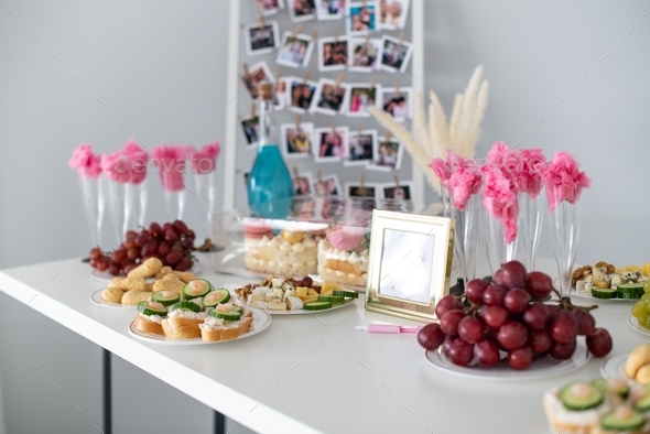 Decorated table with drinks and snacks. Stock Photo by katrinasid