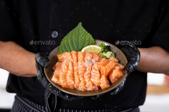 Chef showing sashimi menu Stock Photo by thanyapatm | PhotoDune