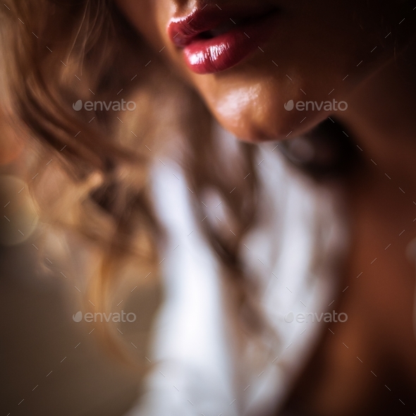 Studio portrait of a beautiful girl in a strict business suit with an ...