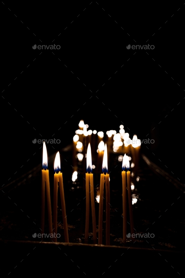 Lit church candles in the temple Stock Photo by katrinasid | PhotoDune
