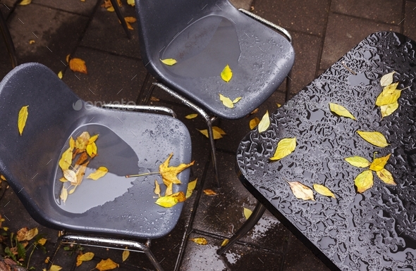 Messy and rainy plastic cafe chairs and table at autumn Stock Photo by ...