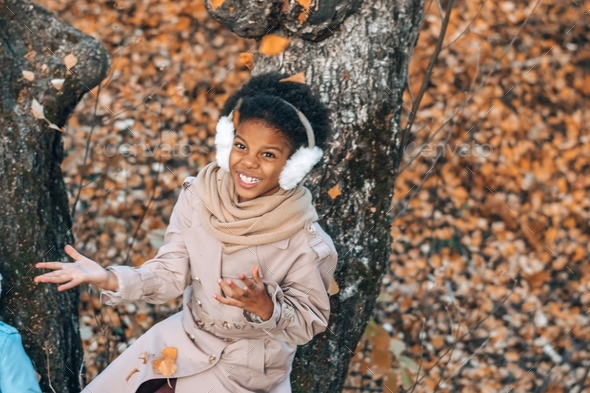 Happy girl in an autumn park.Autumn concept.Diverse people. Stock Photo ...