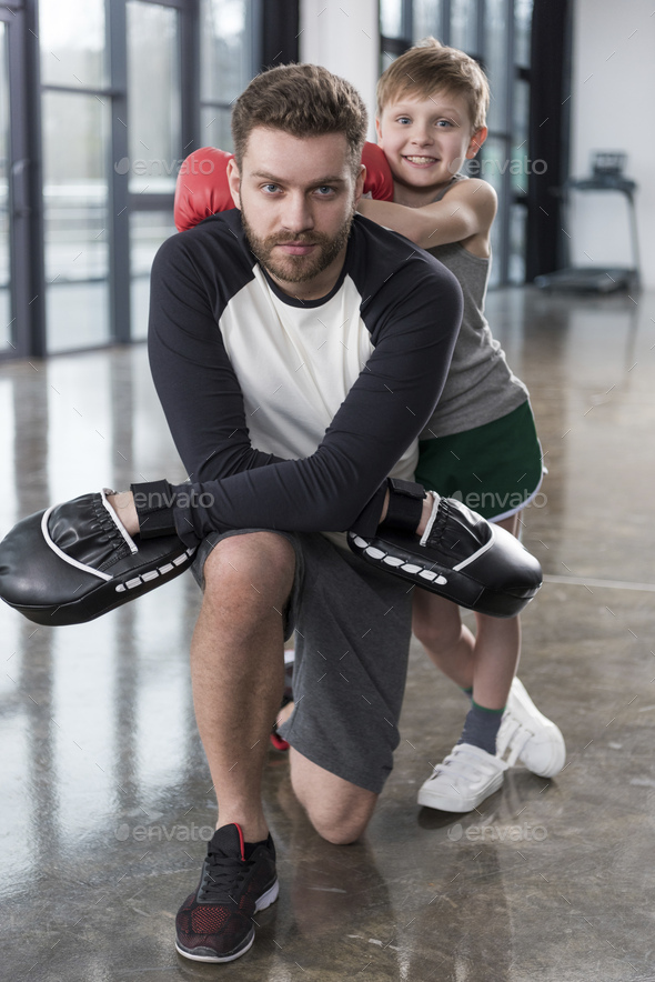 Excited young boy boxer with his coach at training Stock Photo by ...