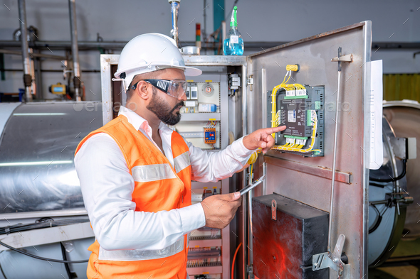 Electrical engineer inspection control panel and commissioning during ...