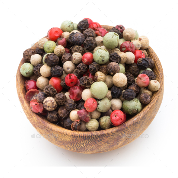 Pepper mix seed on spoon on white background. Stock Photo by GitaKulinica