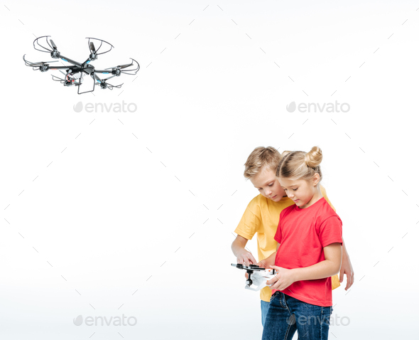 Children playing with flying hexacopter drone isolated on white Stock ...