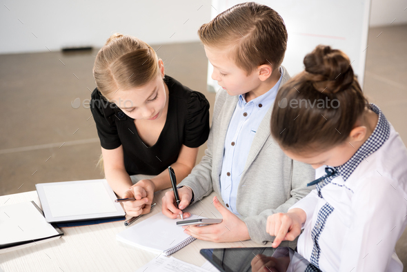 Children working in office like adult business people Stock Photo by ...