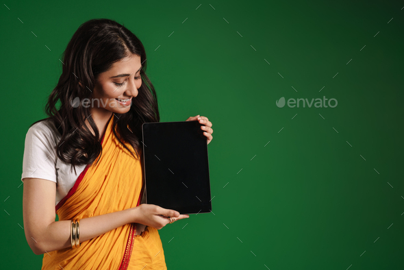 East asian woman wearing sari smiling and showing tablet computer Stock ...