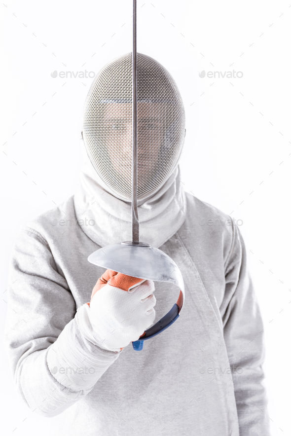 portrait of fencer in uniform holding rapier in hand isolated on white ...