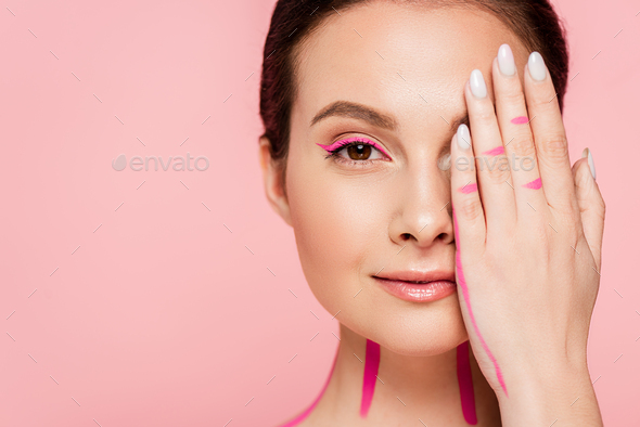 beautiful woman with pink lines on body covering face with hand ...