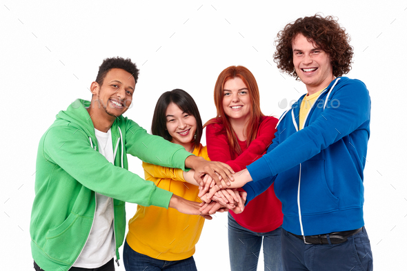 Cheerful international students holding hands together Stock Photo by ...