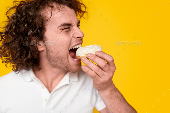Hungry man eating donut Stock Photo by kegfire | PhotoDune