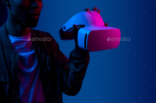 Crop black man showing VR headset Stock Photo by kegfire | PhotoDune