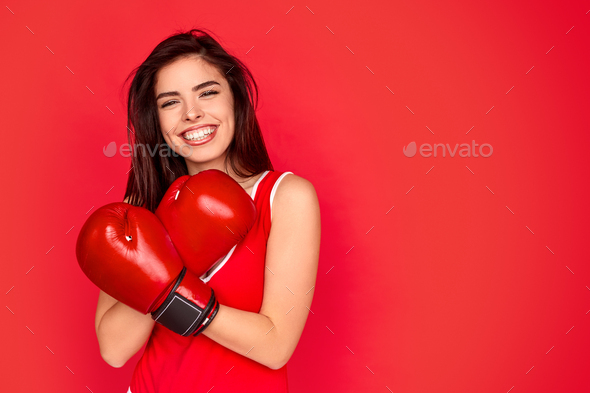 Happy fighter crossing arms in boxing gloves Stock Photo by kegfire