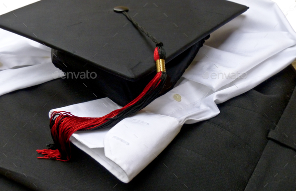 Graduation Cap and Gown attire in black and white with a splash of red ...