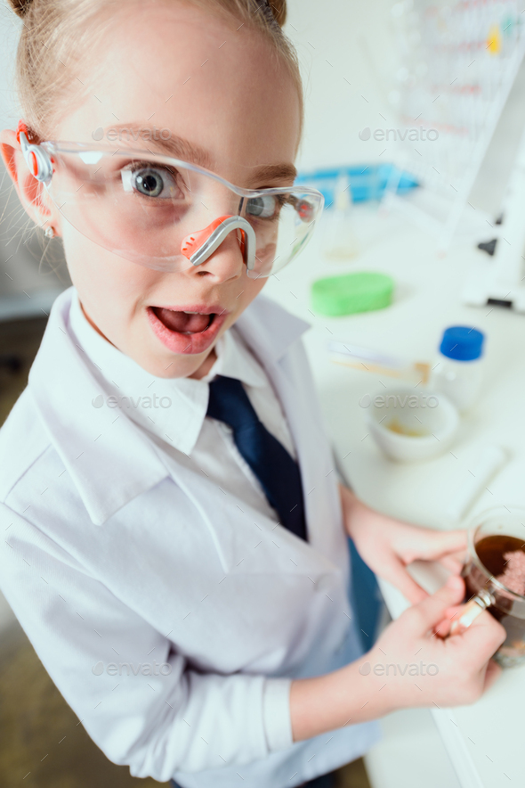 little excited scientist in science laboratory, science student concept ...