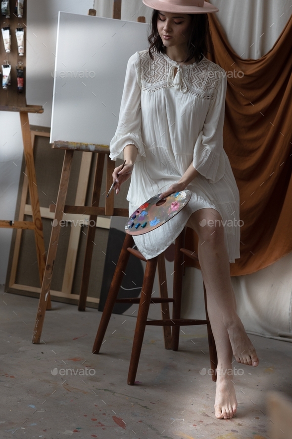 An artist girl in an art workshop Stock Photo by Artichoke-studio ...