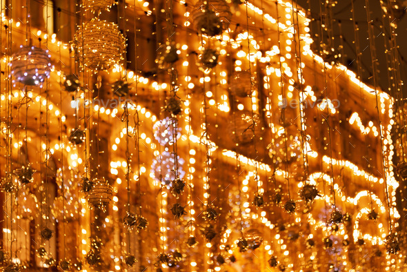 Christmas lights on the rods of the decorated city in a blur. Stock ...