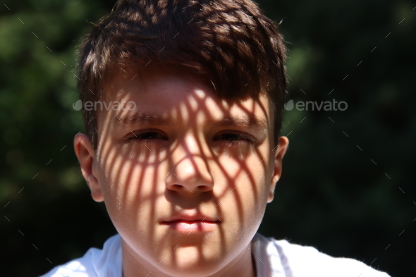 Shadows cast on face of boy Stock Photo by tamaral19 | PhotoDune