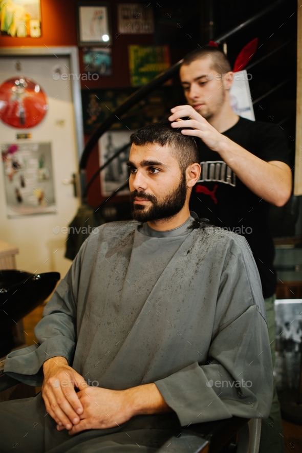 Man cutting hair at the barbershop Stock Photo by Lemnaouer | PhotoDune