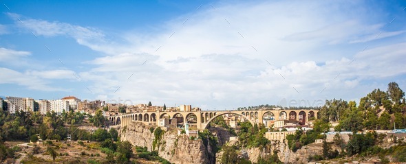 Landscape of a city bridge pont sidi rached Stock Photo by Lemnaouer