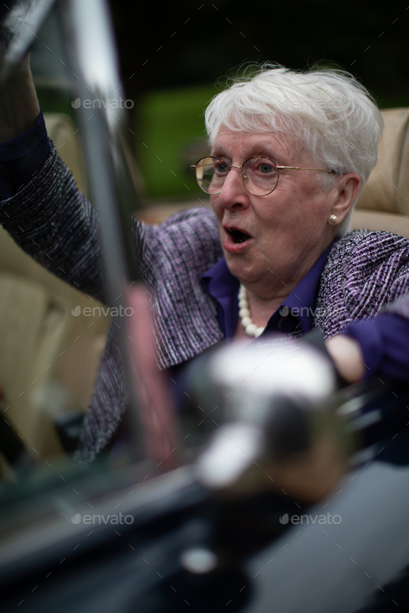 Old woman in vintage car Stock Photo by Lemnaouer | PhotoDune