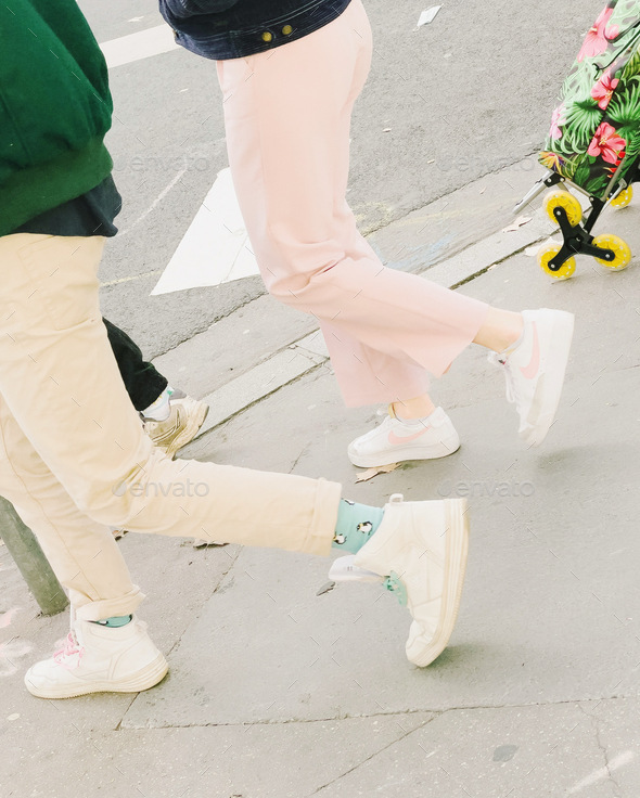 Gen z walking in the street with pastel colored clothes Stock Photo by ...