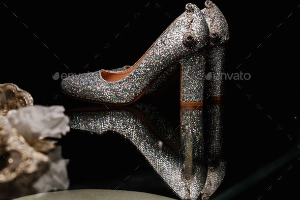 Sparkling shoes on a a reflective surface Stock Photo by Lemnaouer