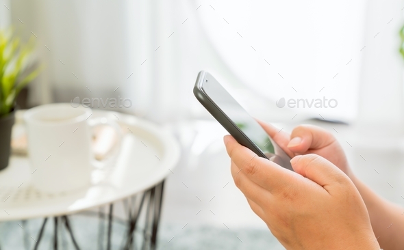 Hand using smartphone, During leisure time Stock Photo by sitthiphong