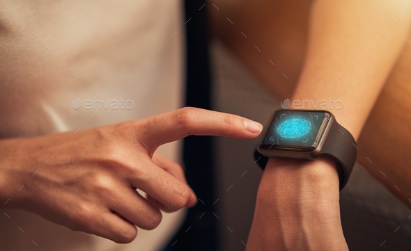 Woman touching and scanning fingerprint on smart watch to unlock Stock ...