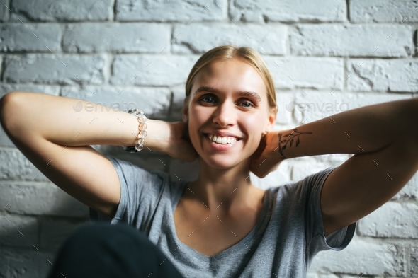 Happy white woman with tattoo is smiling Stock Photo by aksenova_sveta