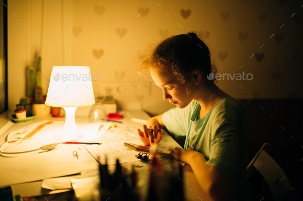 Young girl school student is studying late at night in her room Stock ...