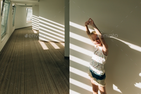 hard light portrait of a young girl with stripe shadows on her face ...