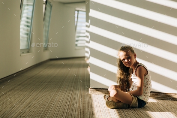 hard light portrait of a young girl with stripe shadows on her face ...