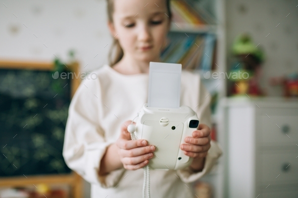 girl taking selfie on her new instant camera, white new photo Stock ...