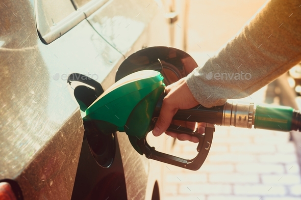 Refueling a car at a gas station Stock Photo by aliona2194 | PhotoDune