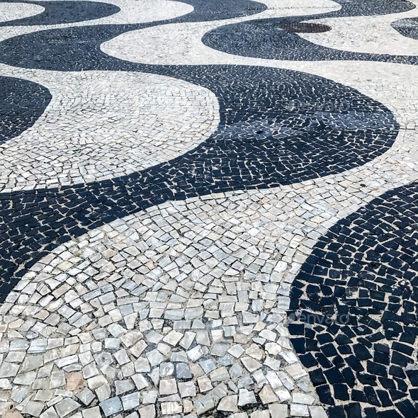 Texture and detail of empty boulevard sidewalk cobblestone pavement of ...