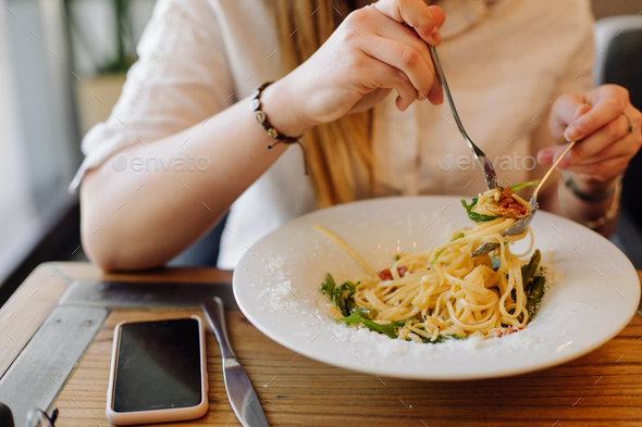 Friends enjoying lunch in the restaurant, eating paste Stock Photo by ...