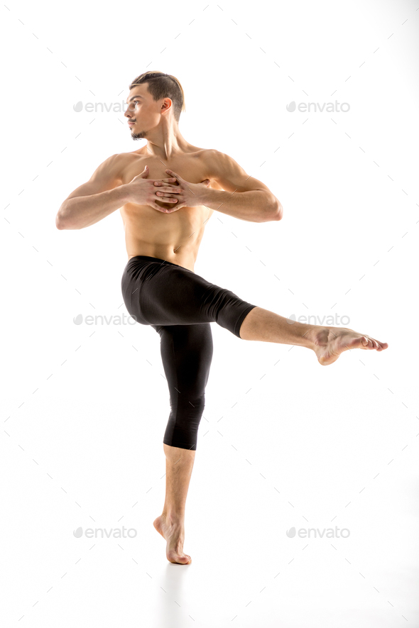 Young handsome shirtless man performing dance movement isolated on ...