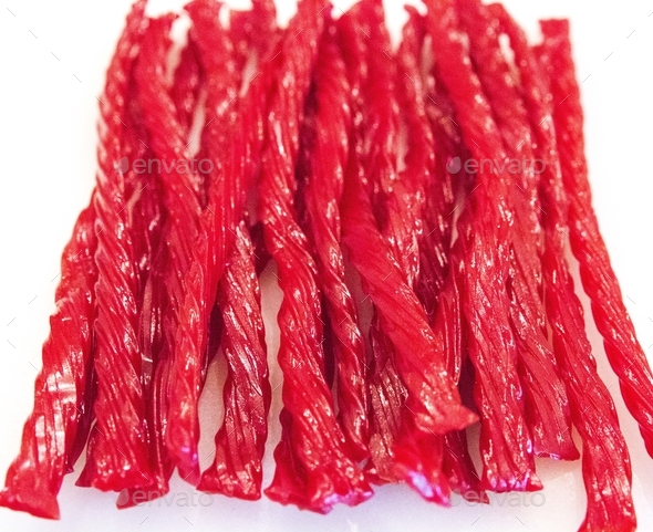A group of red twizzlers on white background Stock Photo by foremankelly