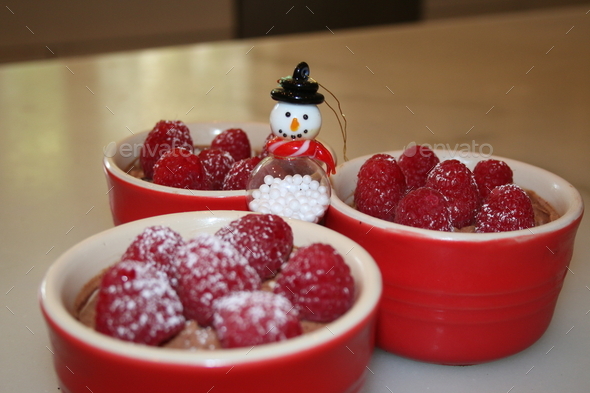 Holiday dessert white chocolate raspberry mousse in red ramekins with a ...