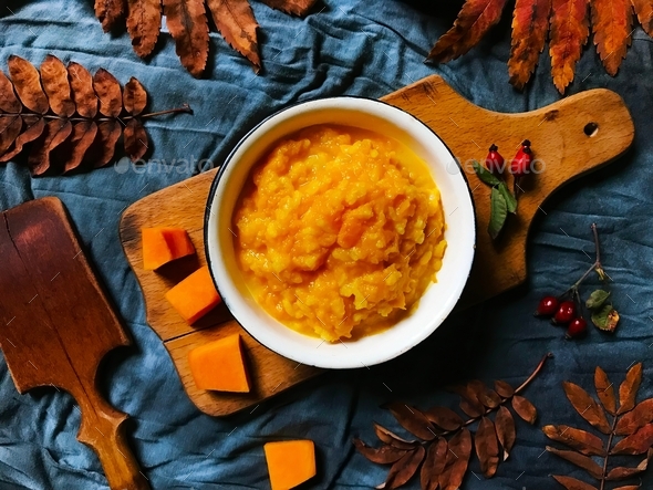 Overhead view of a homemade pumpkin rice porridge decorated by autumn ...
