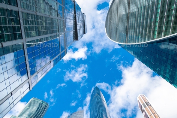Skyscrapers modern architecture office building with clouds in blue sky ...