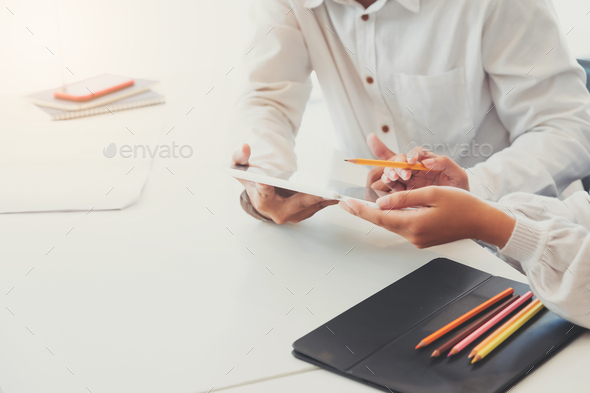 Business people using pen,tablet,notebook are planning a marketing plan ...