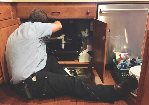 Household chores fixing the pipes repairman. Stock Photo by ...