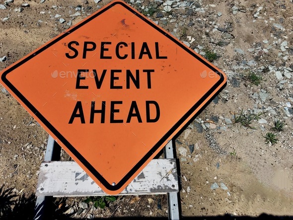 Special Event Ahead road sign lying on the ground because of social ...