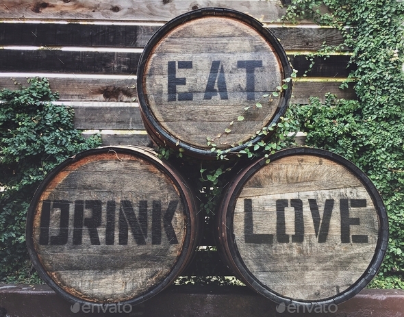 Eat drink love words in the wild on wine barrels. Stock Photo by ...