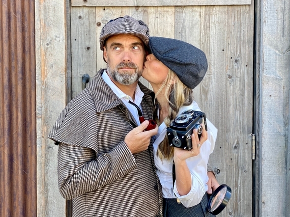 Man and woman retro investigators in cute, couples costume Stock Photo ...