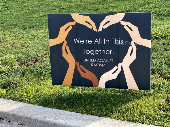 We are all in this together United against racism sign with words in ...