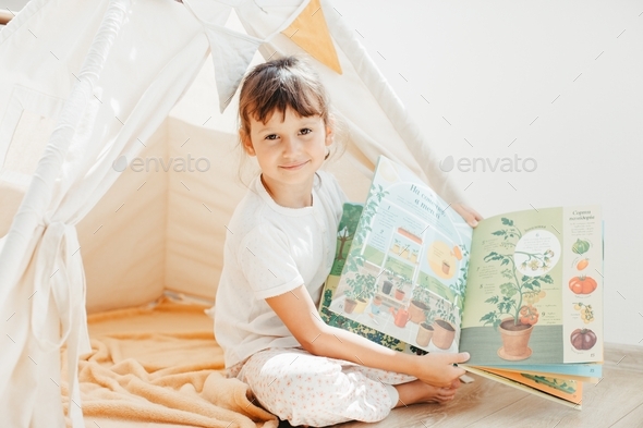 Preschooler child reading book at home Stock Photo by sonyashna | PhotoDune